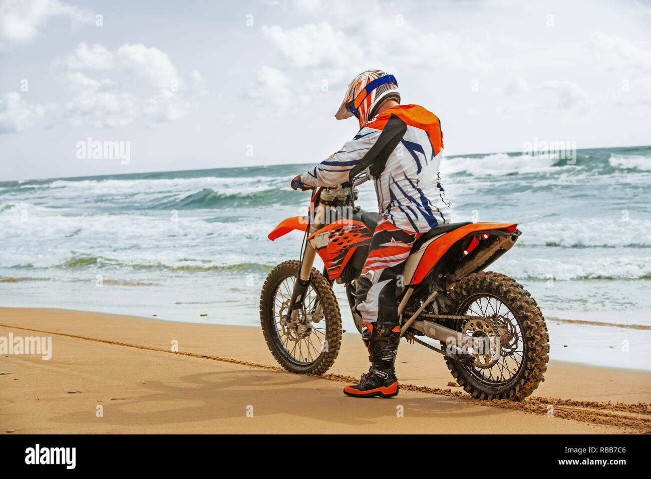 Rear View of Young Man Looking into the camera and Sitting on ...