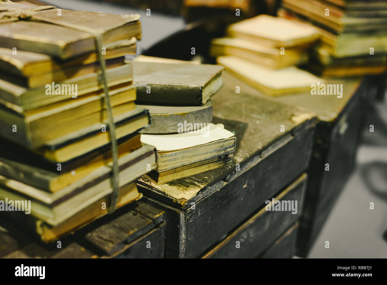 Stack of old books stored in disrepair on an old vintage trunk Stock ...