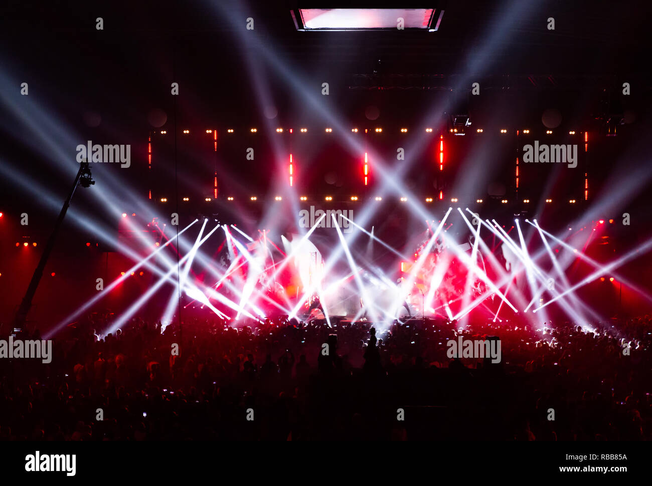 Scene illuminated by beautiful rays of lighting equipment. The concert ...