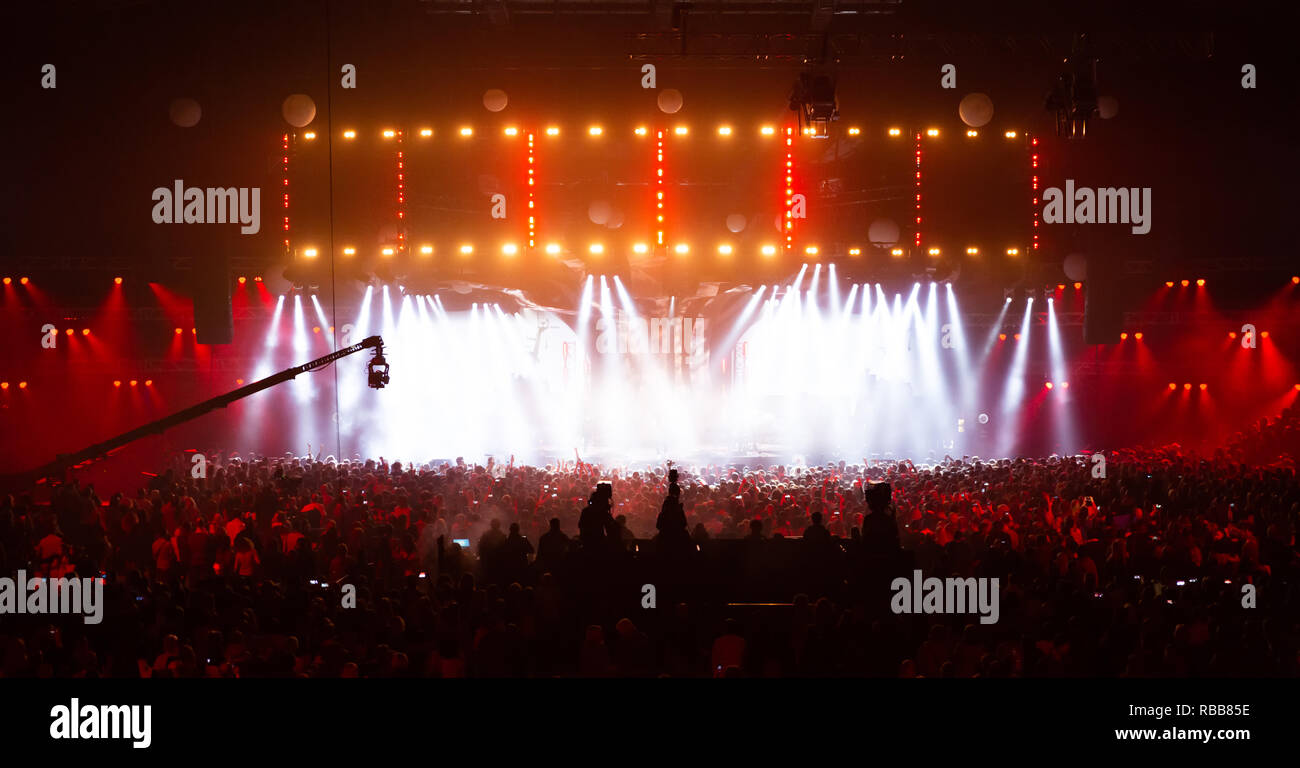 Concert crowd having fun at a rock concert. Large concert hall with a ...