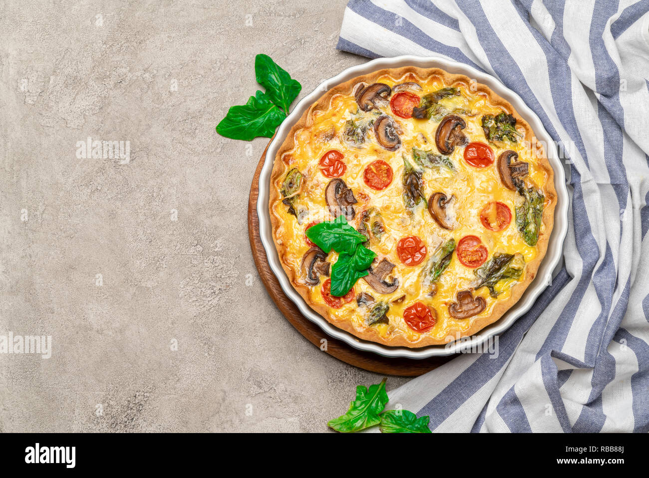 Baked homemade quiche pie in ceramic baking form Stock Photo - Alamy