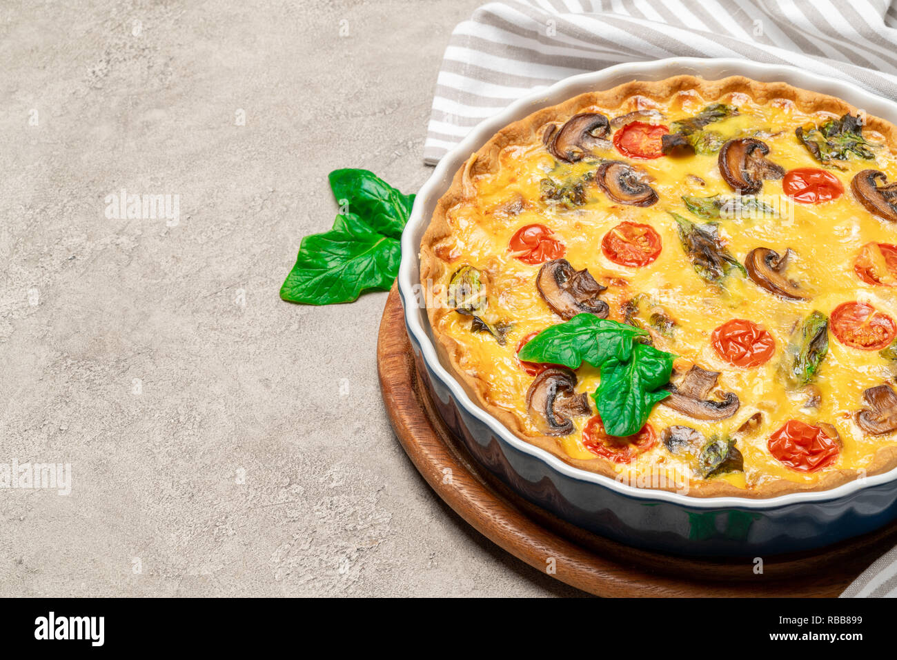 Baked homemade quiche pie in ceramic baking form Stock Photo - Alamy