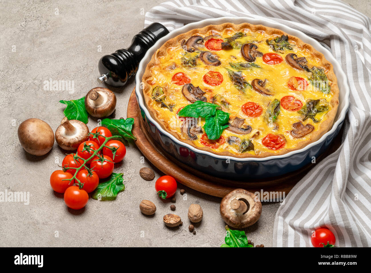 Baked homemade quiche pie in ceramic baking form Stock Photo - Alamy