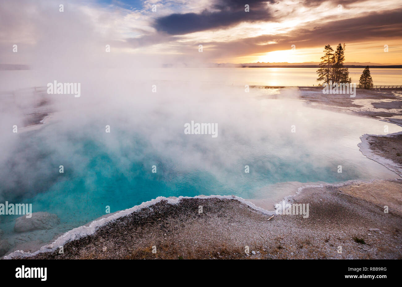 Wooden boardwalk along geyser fields in Yellowstone National Park, USA ...