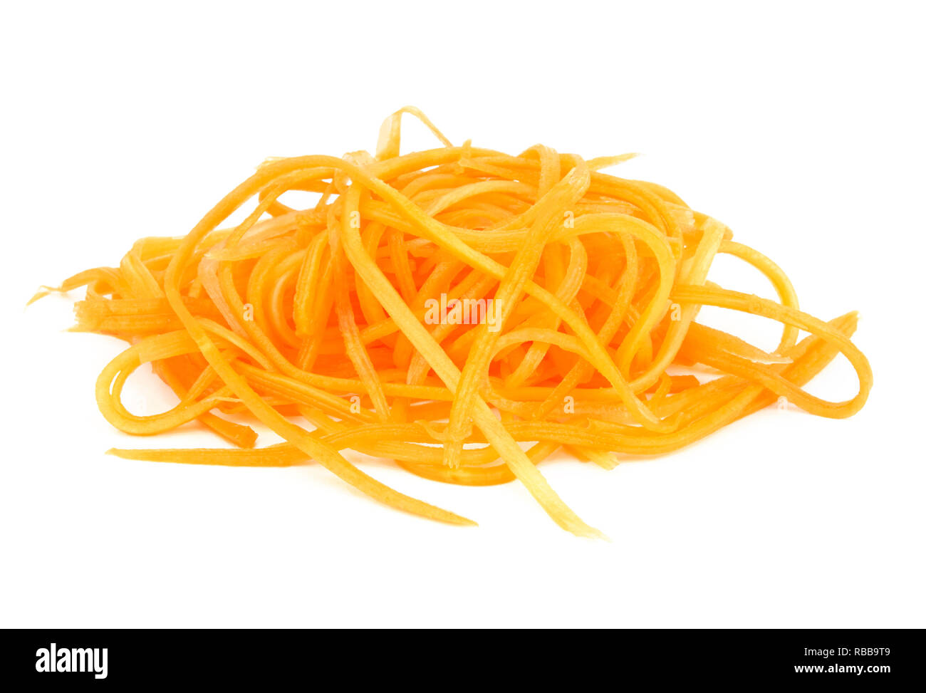 Grated carrot isolated on a white background Stock Photo - Alamy