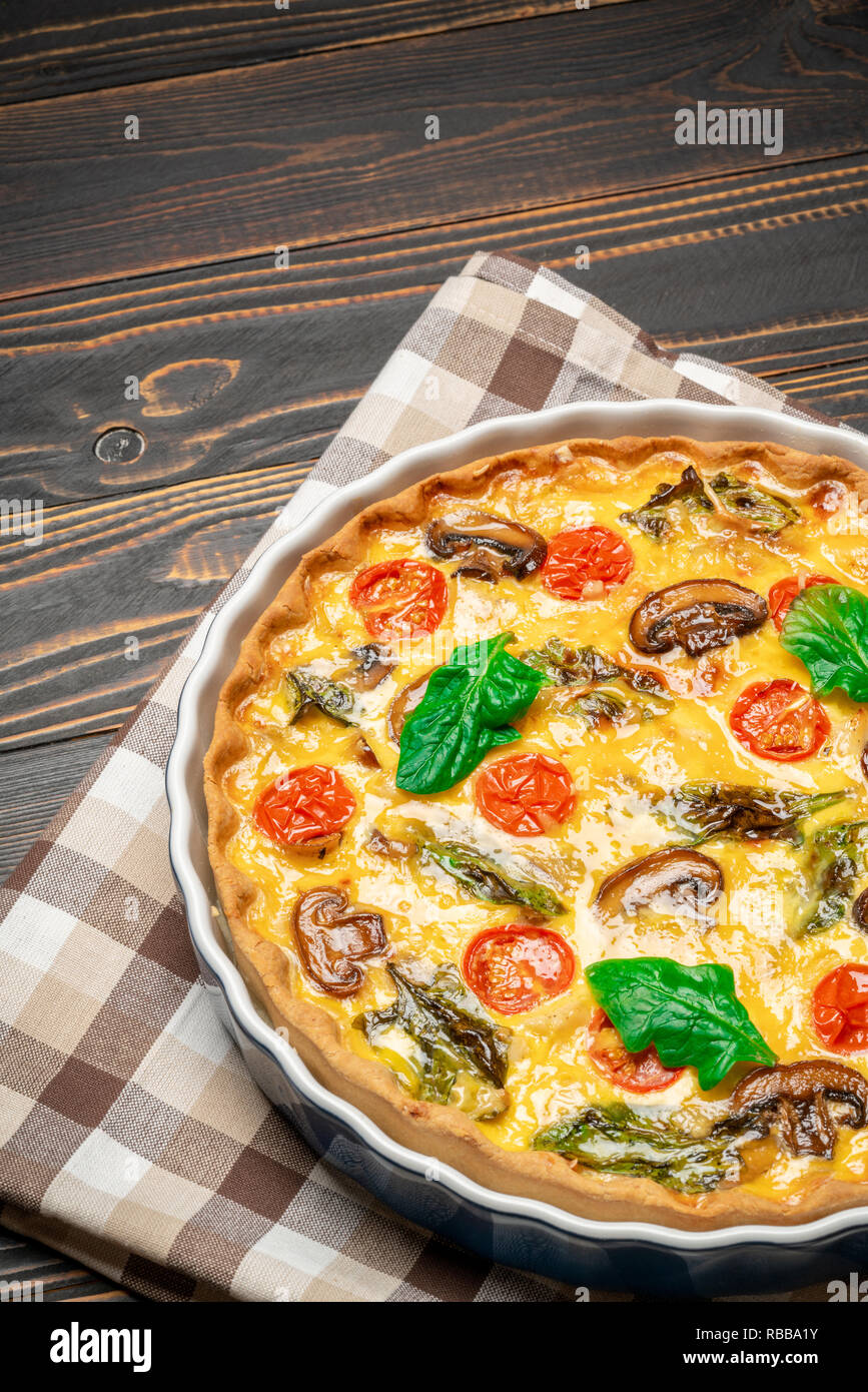 Baked homemade quiche pie in ceramic baking form Stock Photo - Alamy