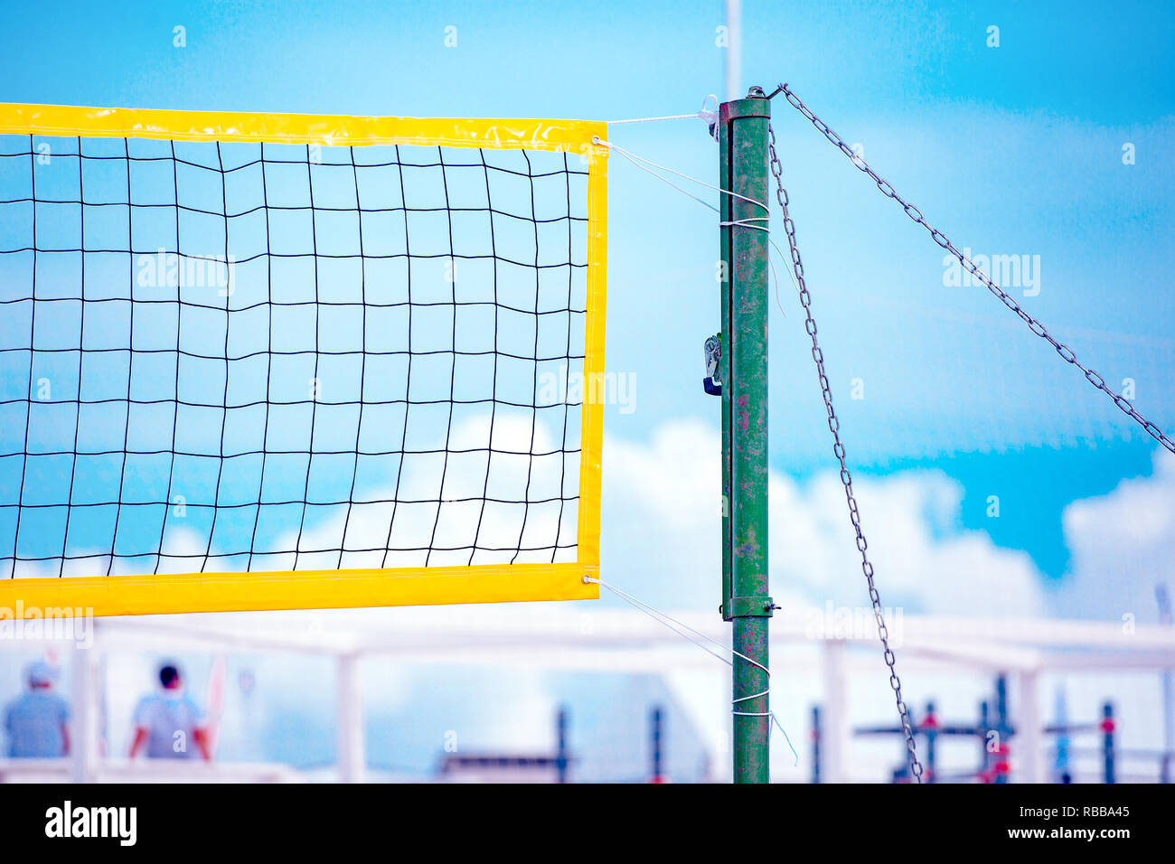 Beach Volleyball. Game ball under sunlight and blue sky. Volleyball net ...