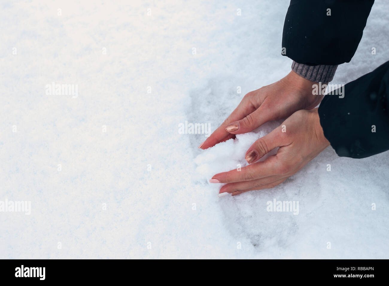 Making snowballs close up Stock Photo - Alamy
