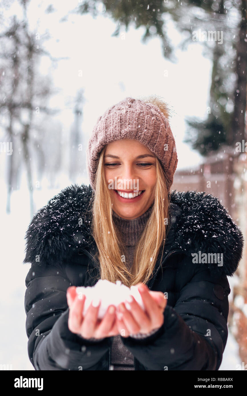 Girl catching snow in hands hi-res stock photography and images - Alamy