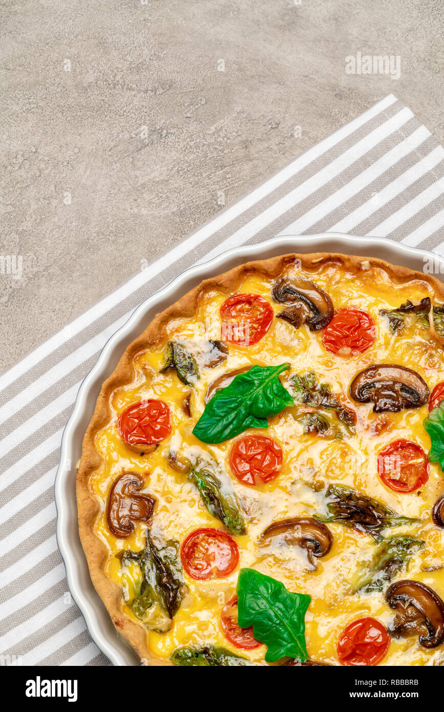 Baked homemade quiche pie in ceramic baking form Stock Photo - Alamy