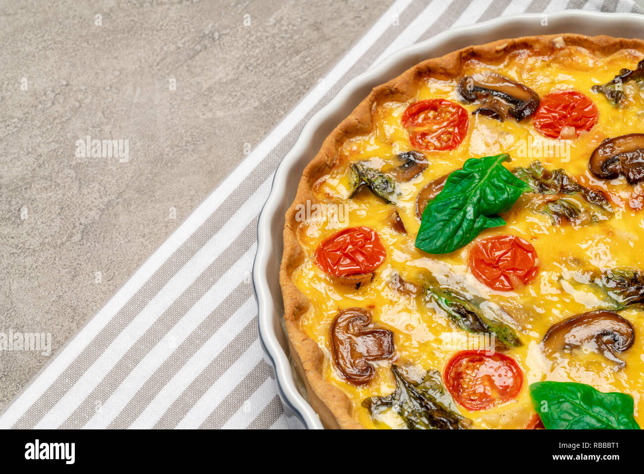 Baked homemade quiche pie in ceramic baking form Stock Photo - Alamy
