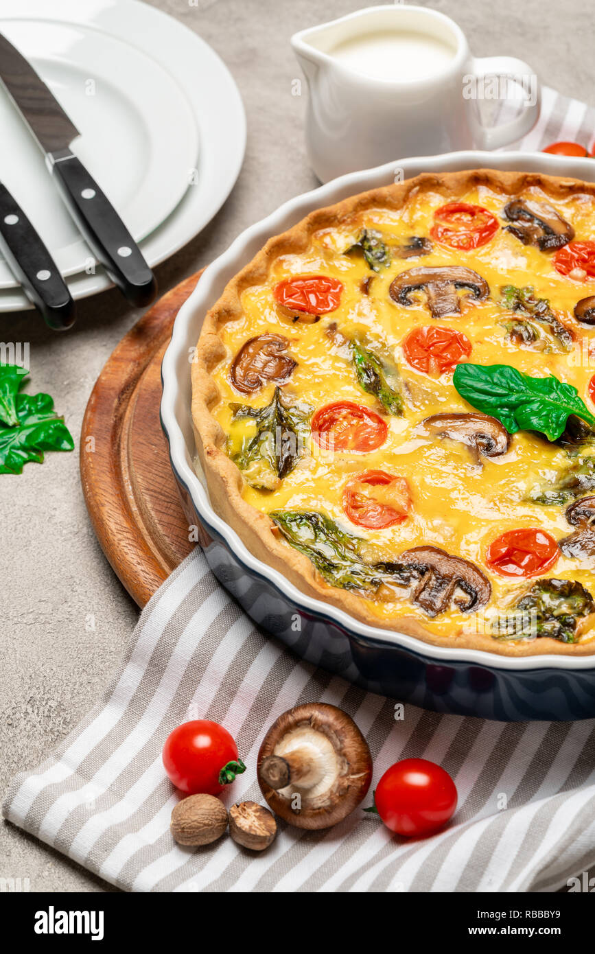Baked homemade quiche pie in ceramic baking form Stock Photo - Alamy
