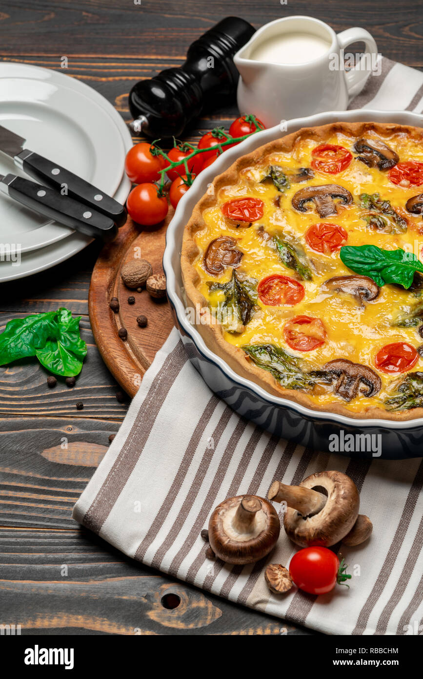 Baked homemade quiche pie in ceramic baking form Stock Photo - Alamy