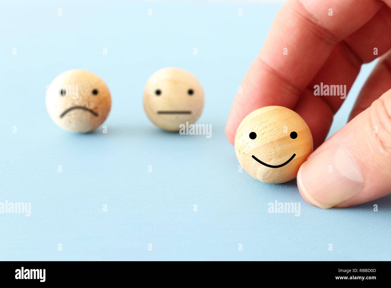 concept photo of chosen person among others. a smiling face stands out ...