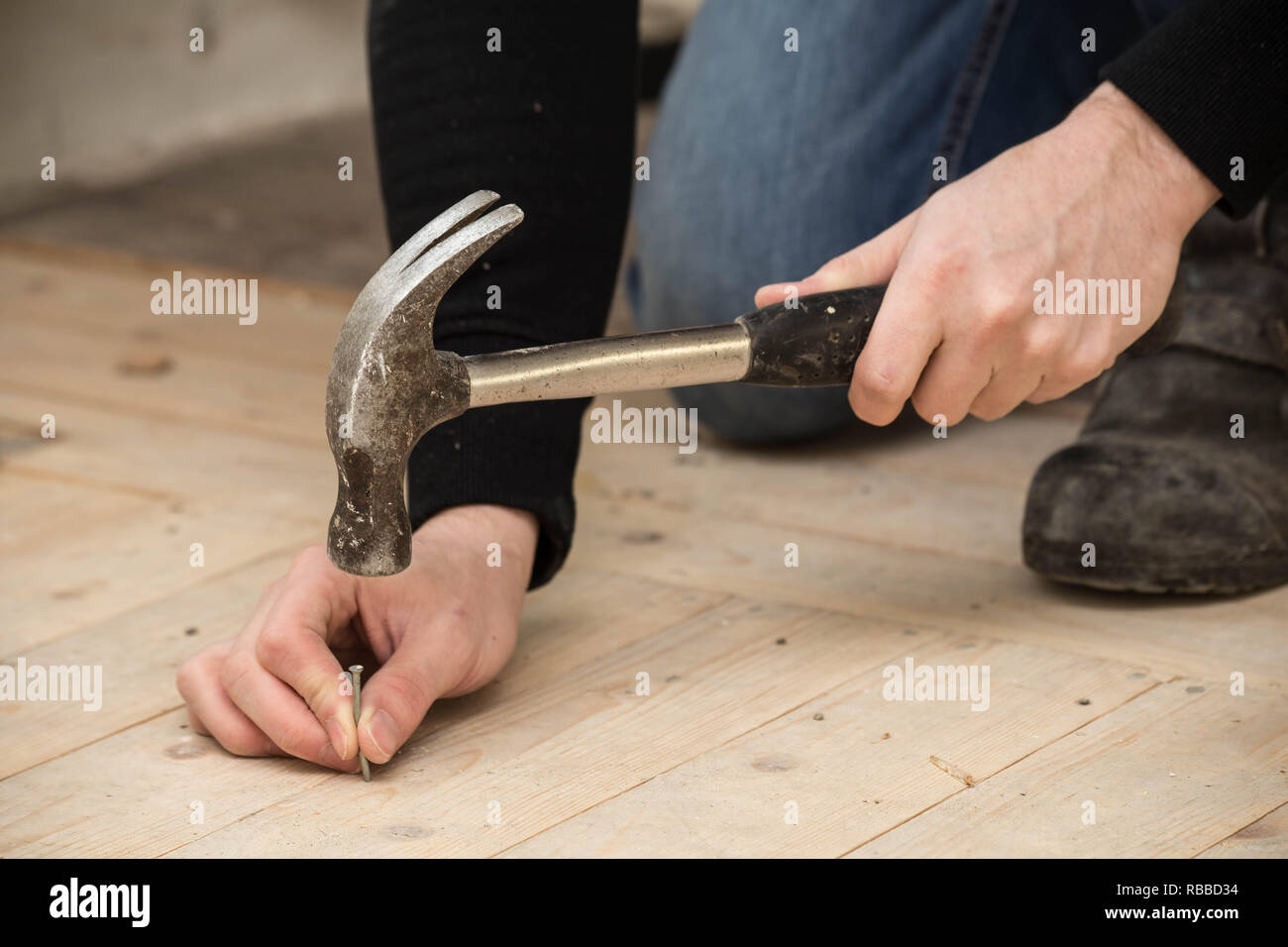 Men Using a hammer and nail on wood , renovation concept Stock Photo ...