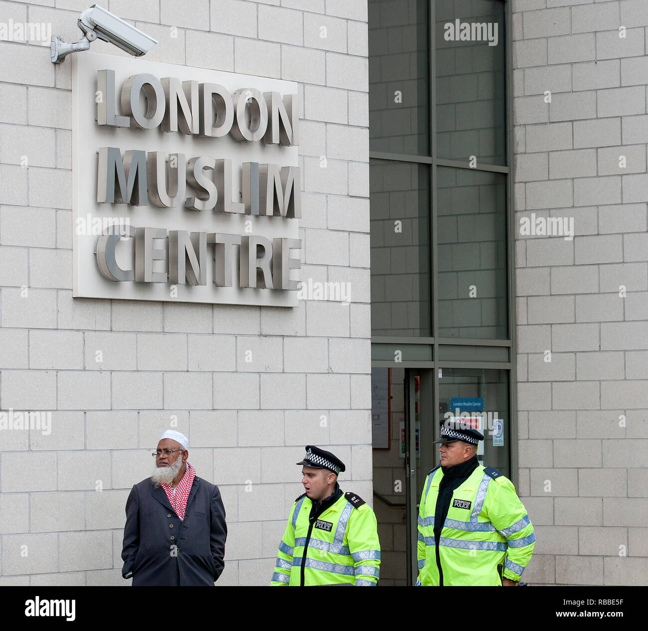 Police officers patrol past The London Muslim Centre, aka East London ...