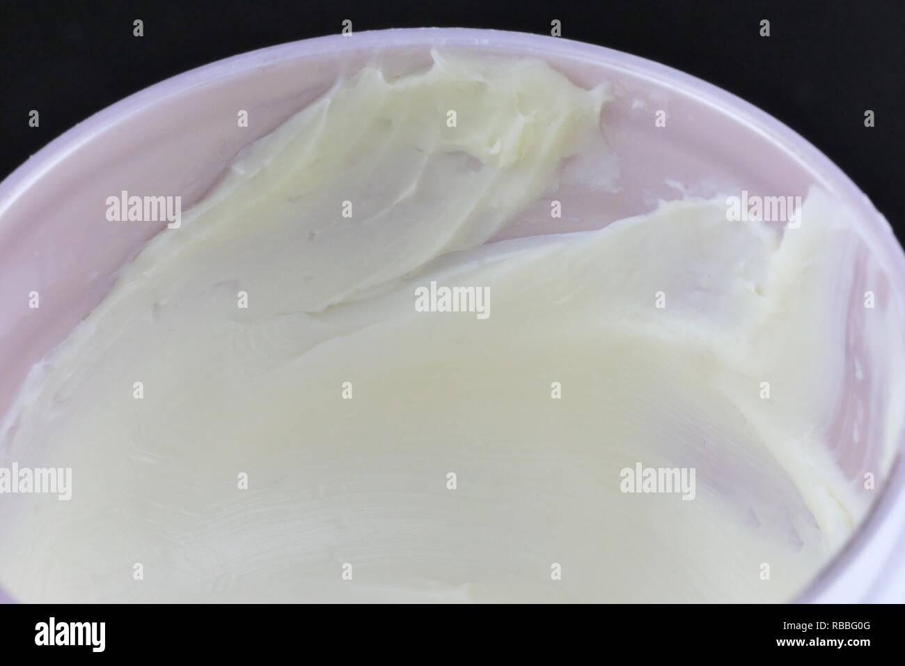 Container of hair grooming product for styling hair Stock Photo - Alamy