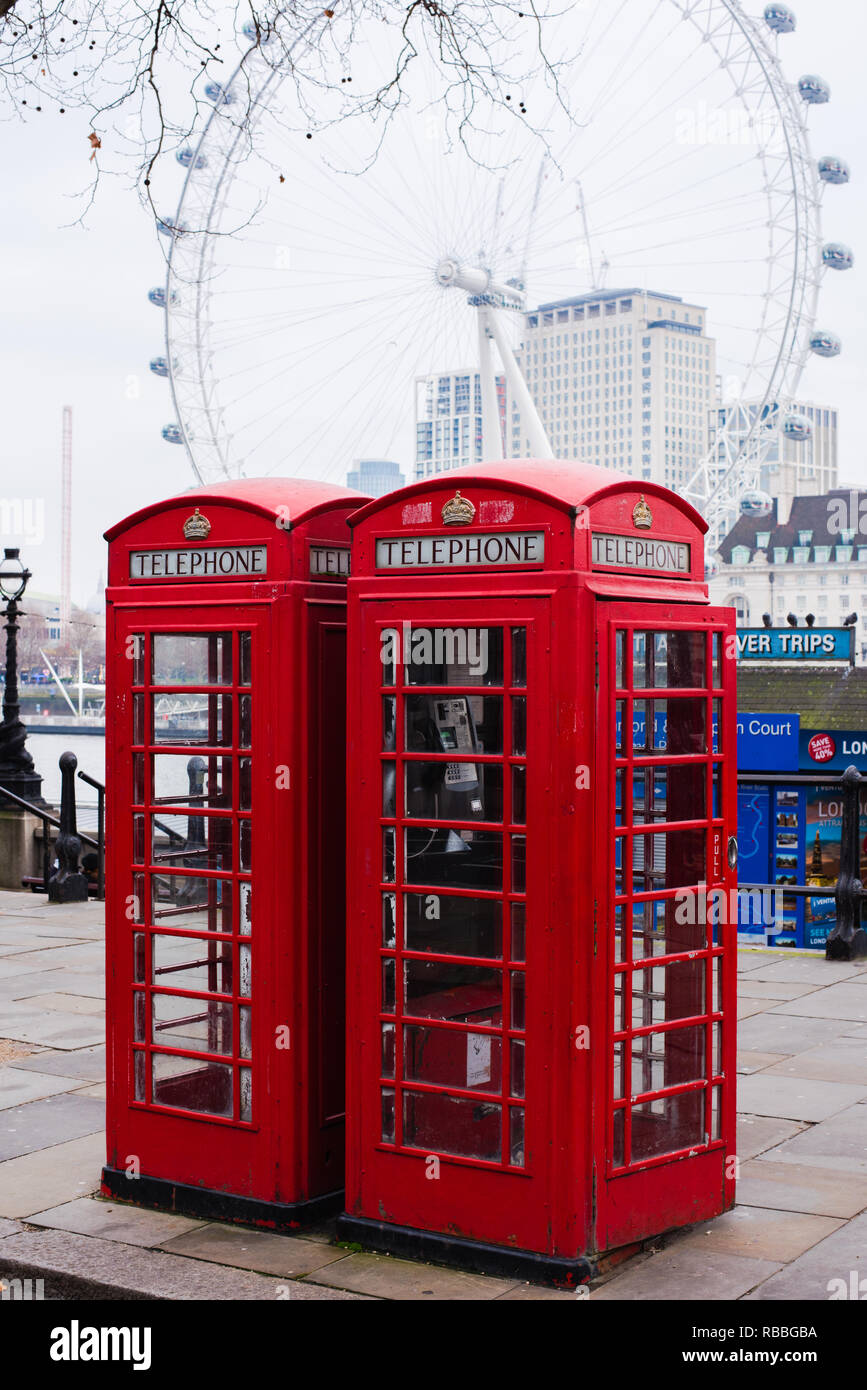 World famous London telephone booth with the London eye landmark at the ...
