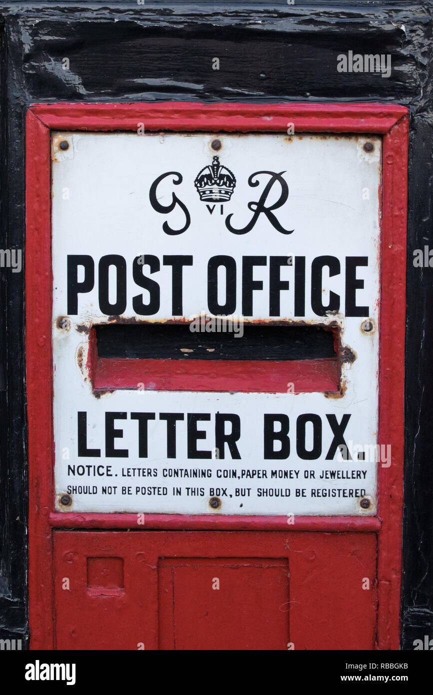 An old red post box embedded in the wall Stock Photo - Alamy