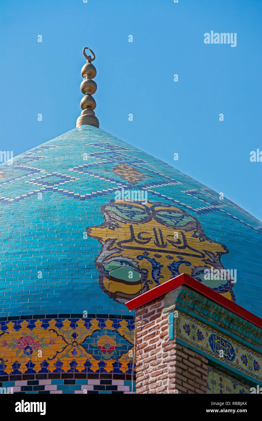 Close up of a blue and gold mosaic tiled domed roof of an islamic ...