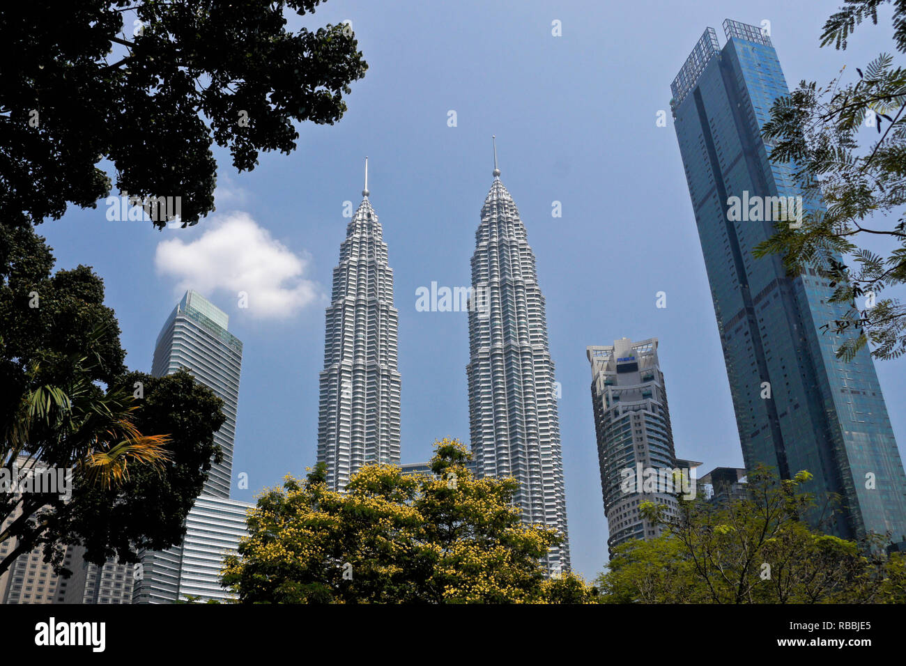 Petronas Twin Towers and downtown skyscrapers viewed from KLCC Park ...