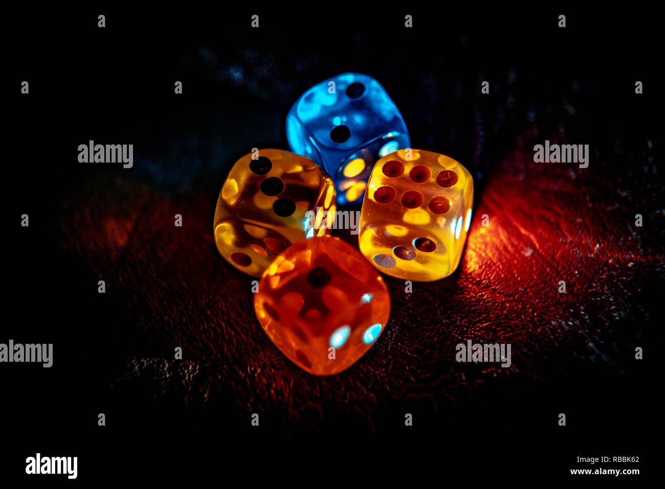 Dices of several colors, red, green, blue and black and white with soft ...