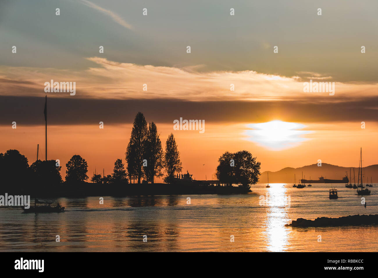 Photo of Sunset at Sunset Beach in Vancouver, BC, Canada Stock Photo ...
