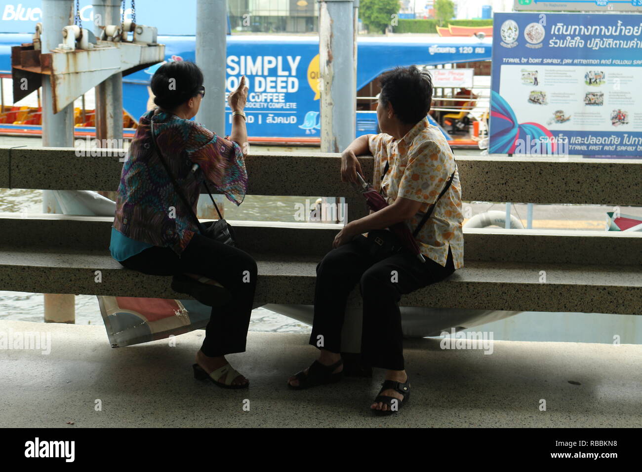 two men siting Stock Photo - Alamy