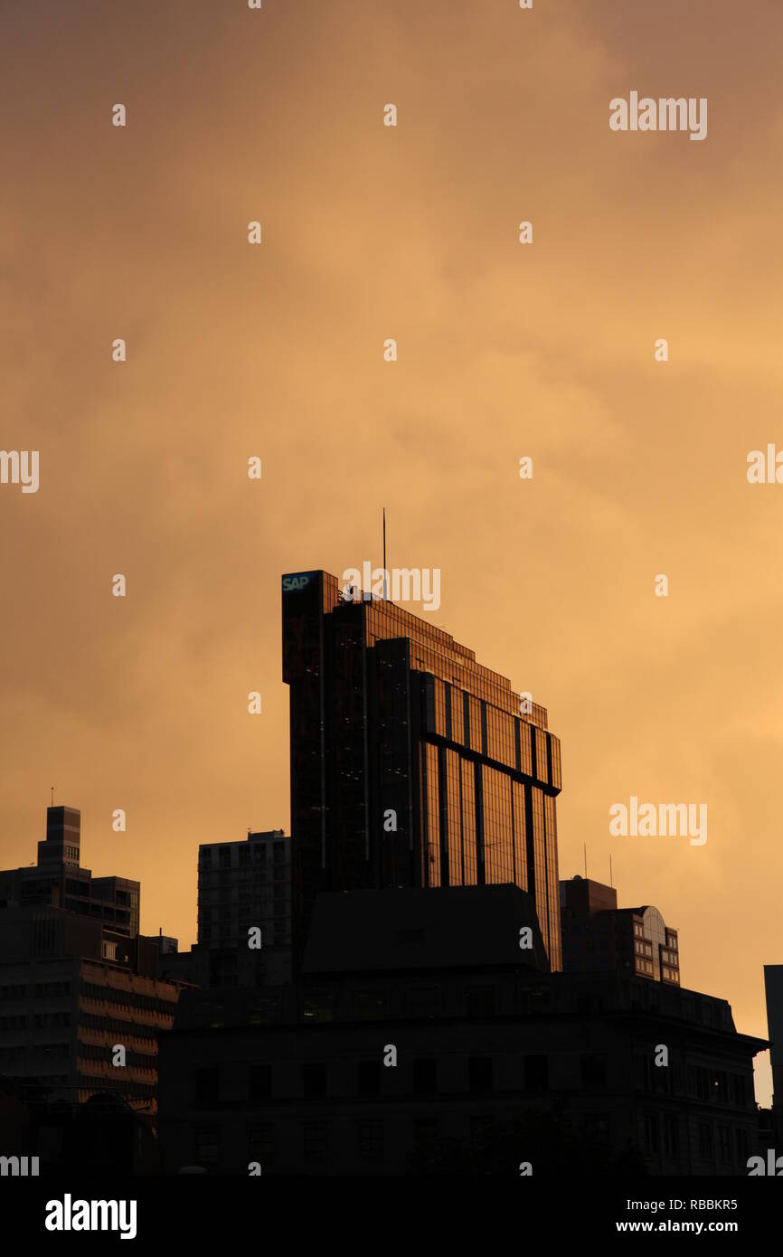 High rise office building at sunset in the city Stock Photo - Alamy