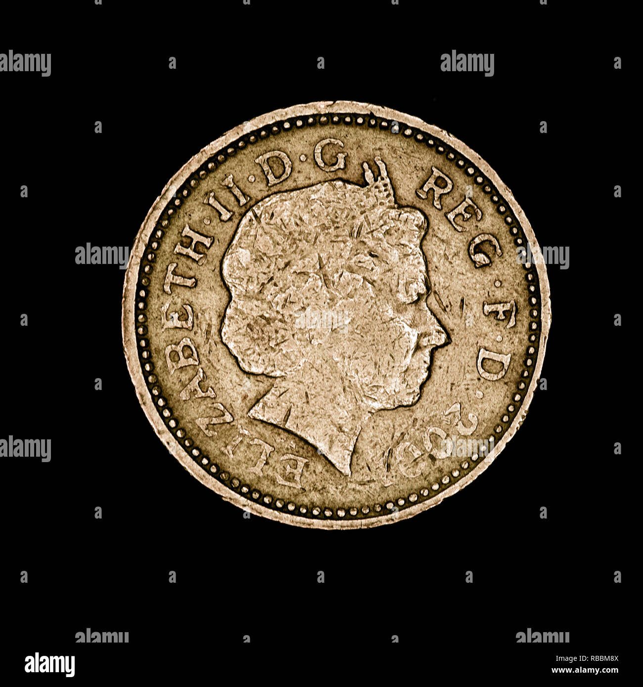 One old british pound coin on black background Stock Photo - Alamy