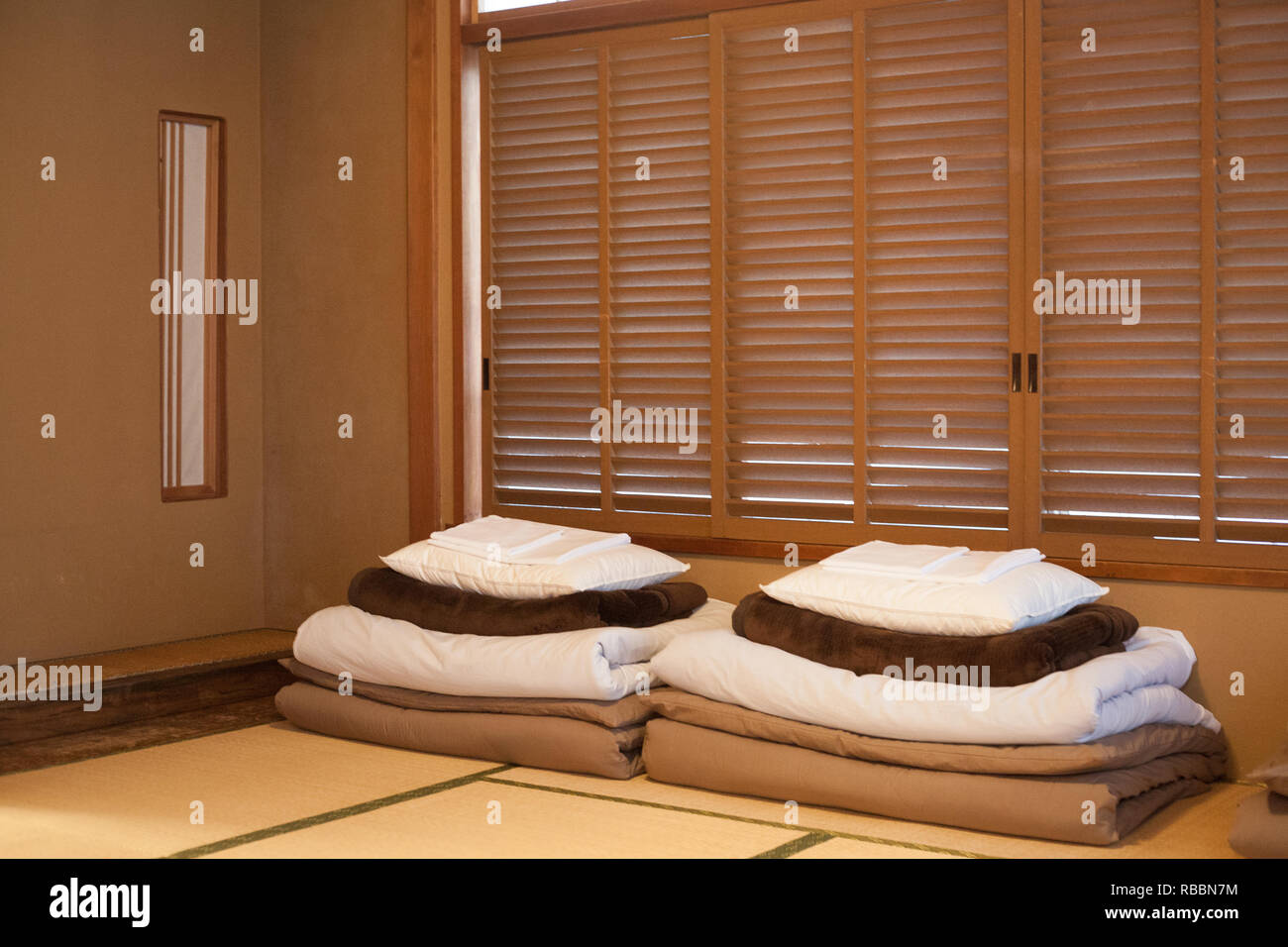 Folded sheets in Japanese Ryokan hotel bedroom Stock Photo - Alamy