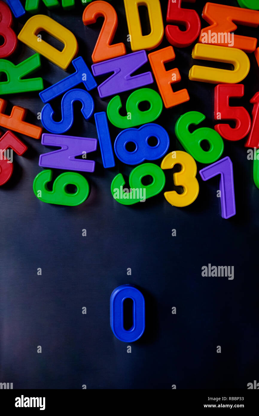 Colorful magnetic numbers and letters grouped on the fridge Stock Photo ...