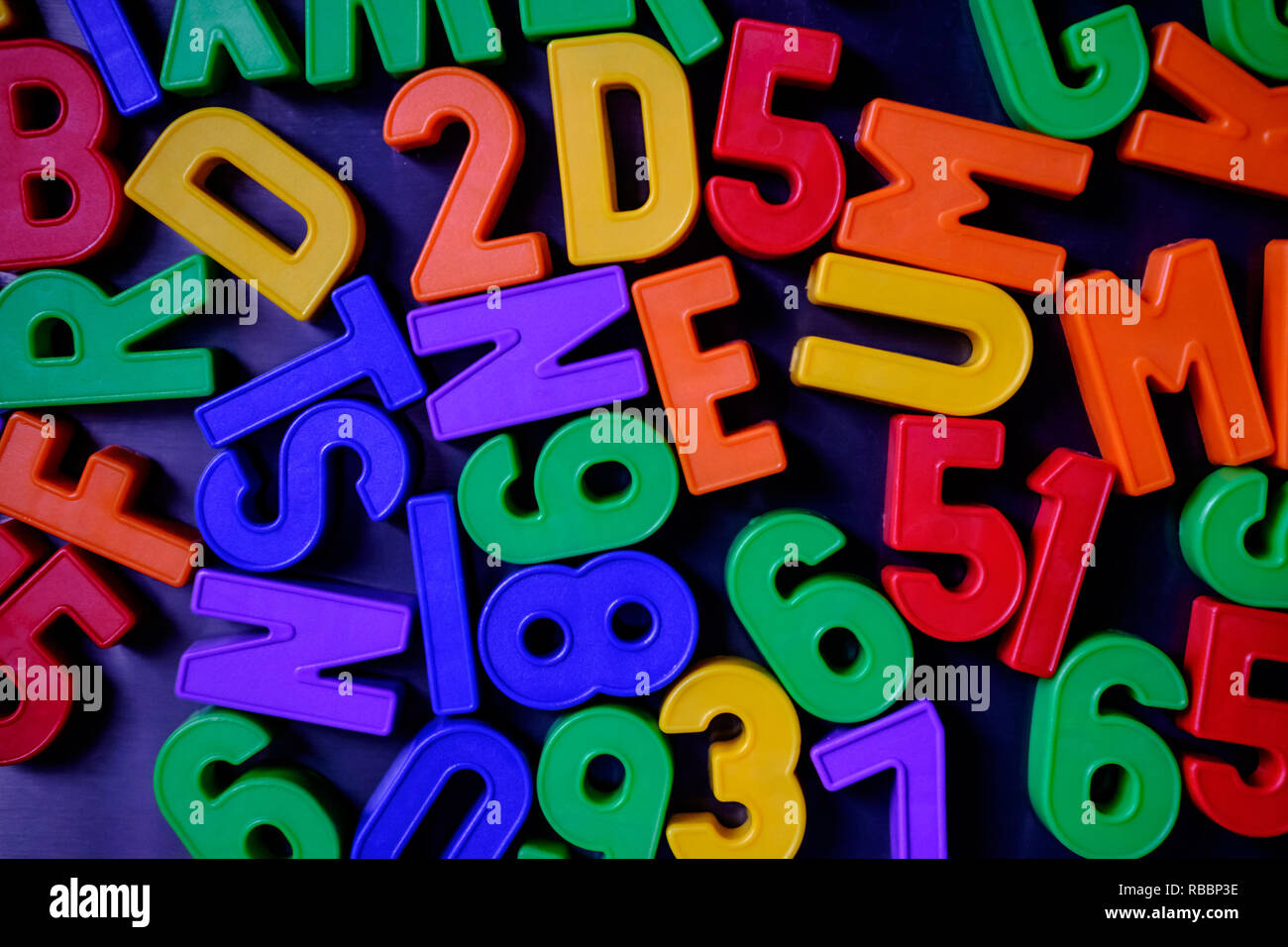 Colorful magnetic numbers and letters grouped on the fridge Stock Photo ...