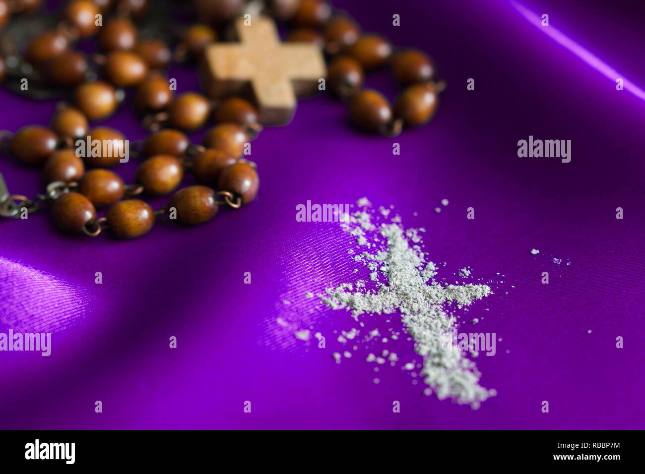Ash Wednesday religion concept on violet fabric background with rosary ...