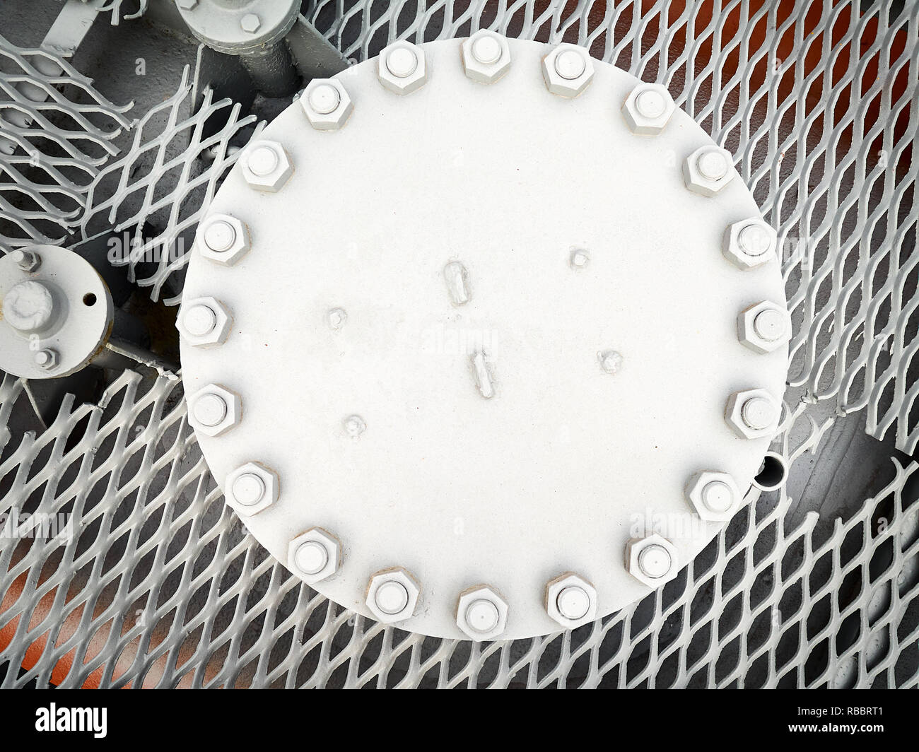 Metal hatch close-up on neck of tank painted with gray paint bolted ...