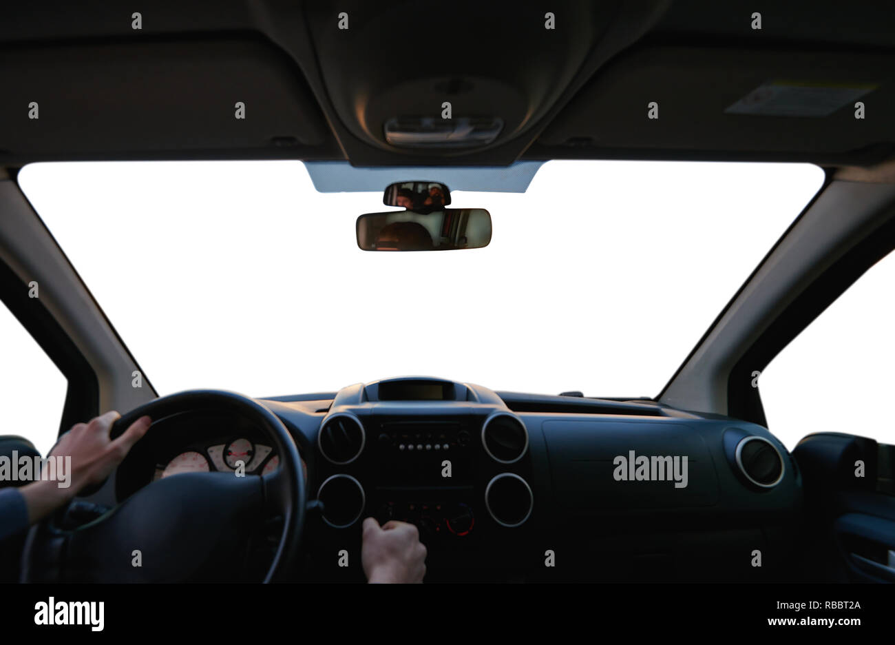 Young driver inside car with white background Stock Photo - Alamy