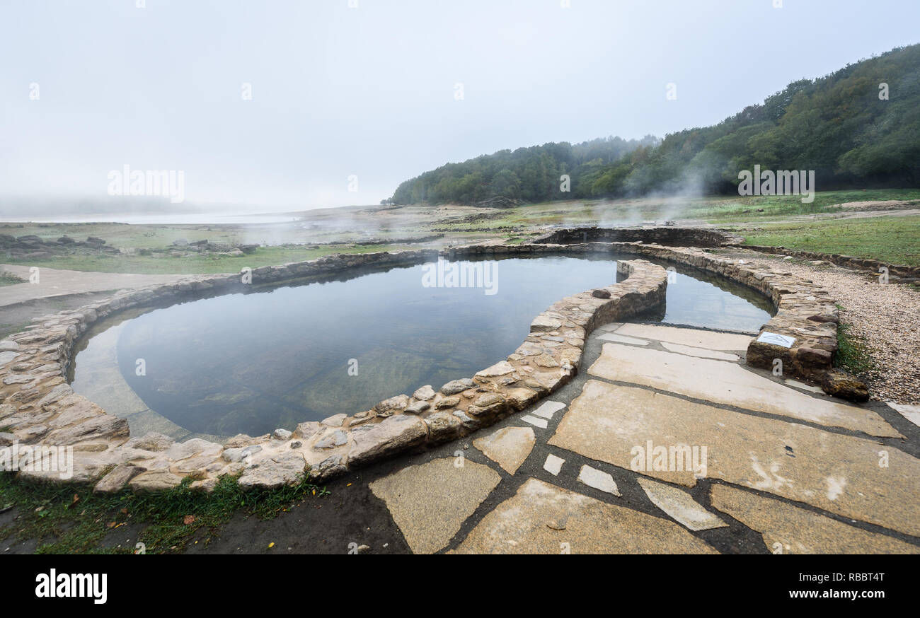 Natural Roman baths outdoors with hot steam and thermal water. Old ...