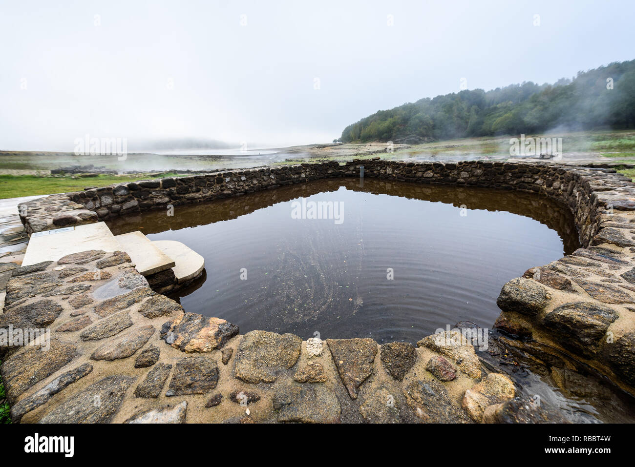 Natural Roman baths outdoors with hot steam and thermal water. Old ...