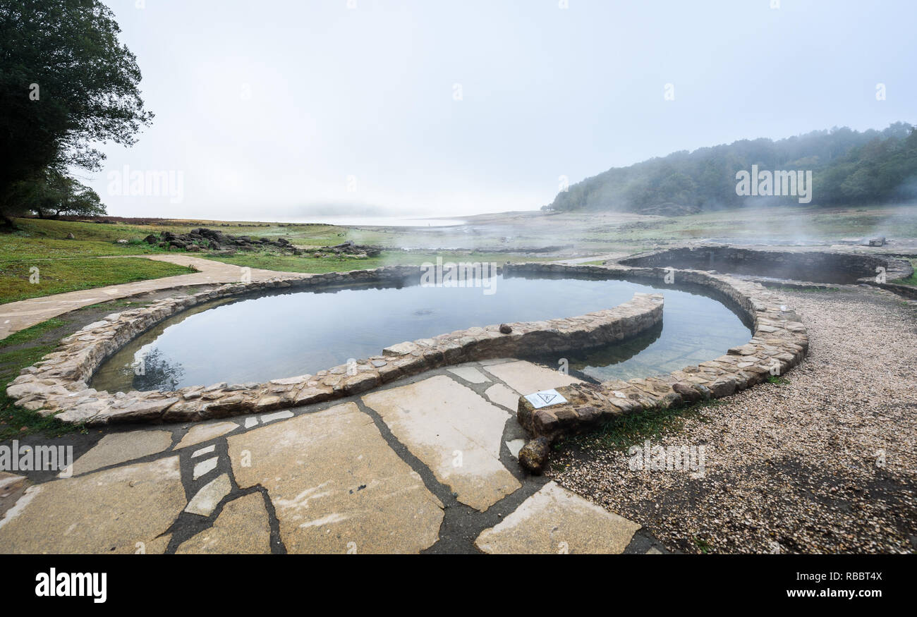 Natural Roman baths outdoors with hot steam and thermal water. Old ...