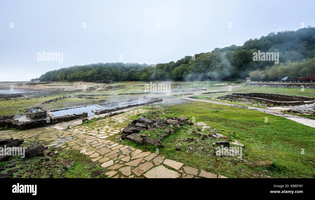 Natural Roman baths outdoors with hot steam and thermal water. Old ...