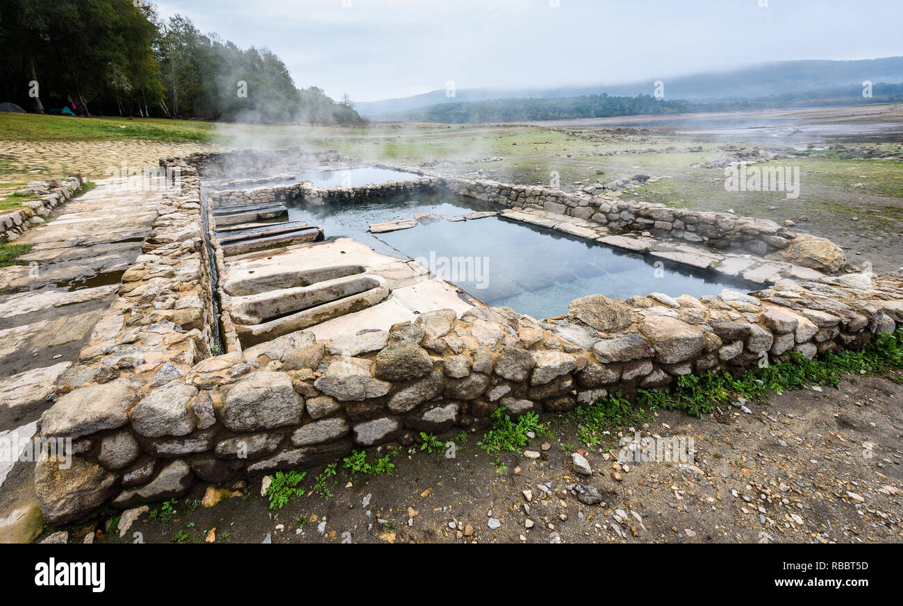 Natural Roman baths outdoors with hot steam and thermal water. Old ...