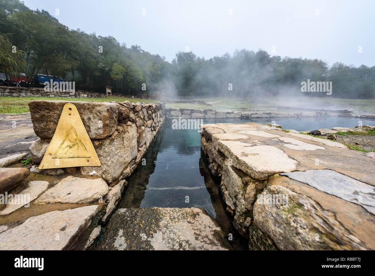 Natural Roman baths outdoors with hot steam and thermal water. Old ...