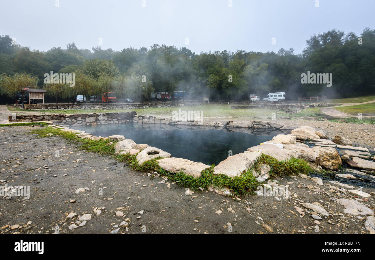 Natural Roman baths outdoors with hot steam and thermal water. Old ...