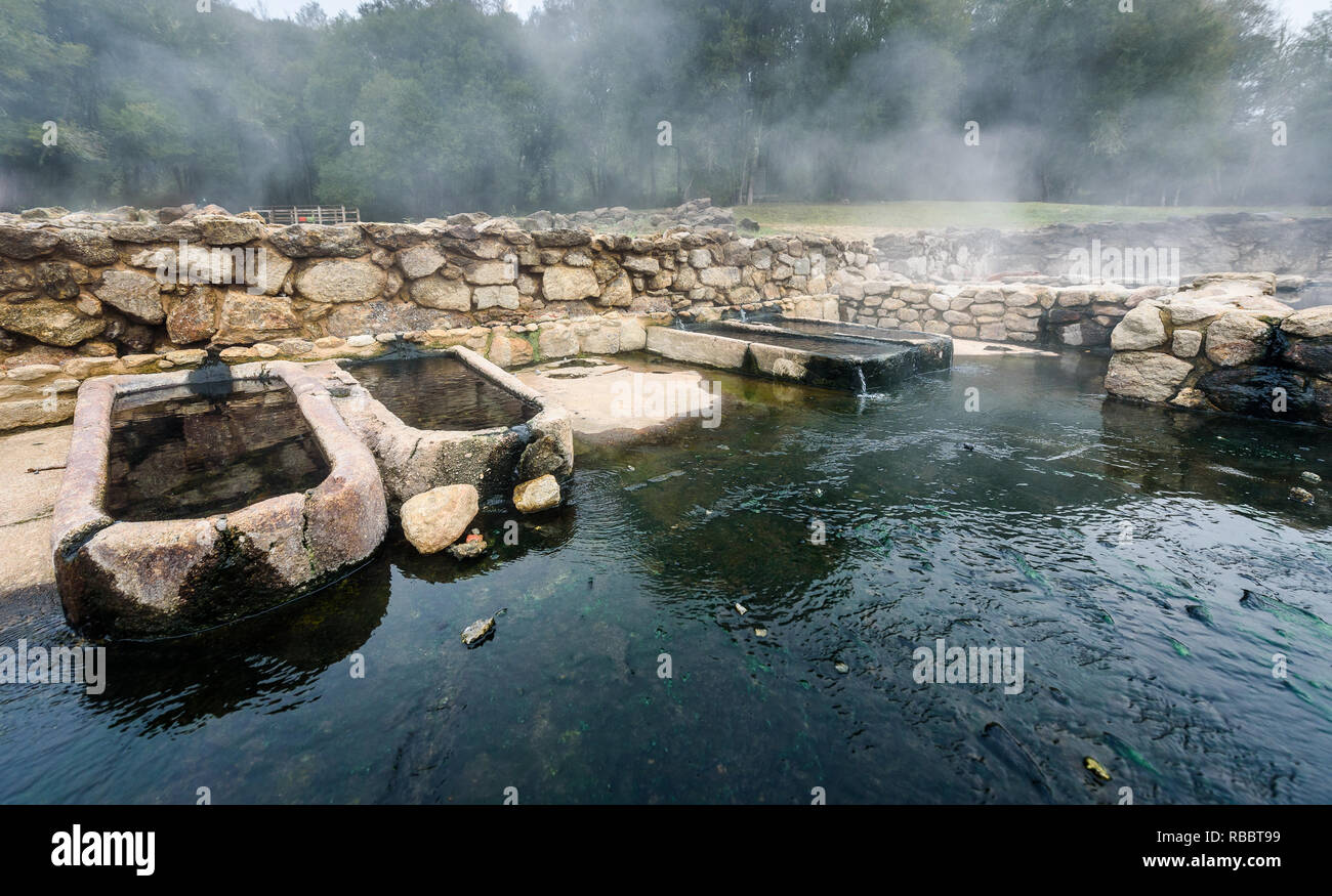 Natural Roman baths outdoors with hot steam and thermal water. Old ...