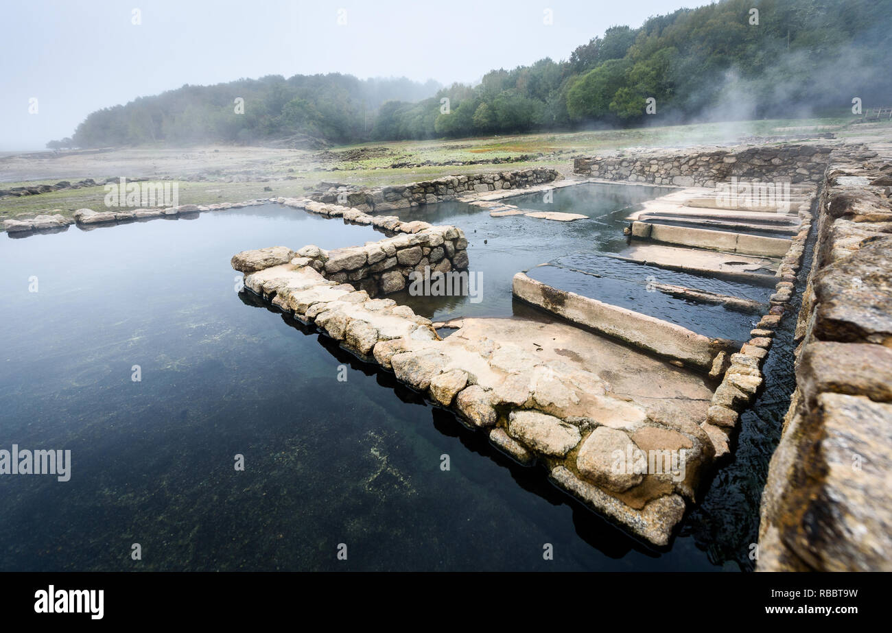Natural Roman baths outdoors with hot steam and thermal water. Old ...