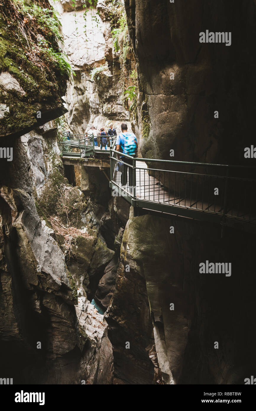 People crossing the gorge (Orrido di Bellano) adventure concept Stock ...