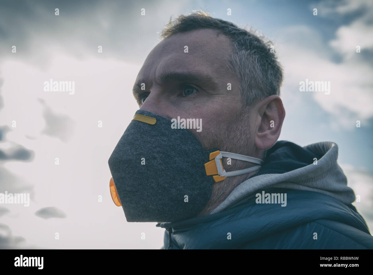 man wearing a real anti-pollution, anti-smog and viruses face mask ...