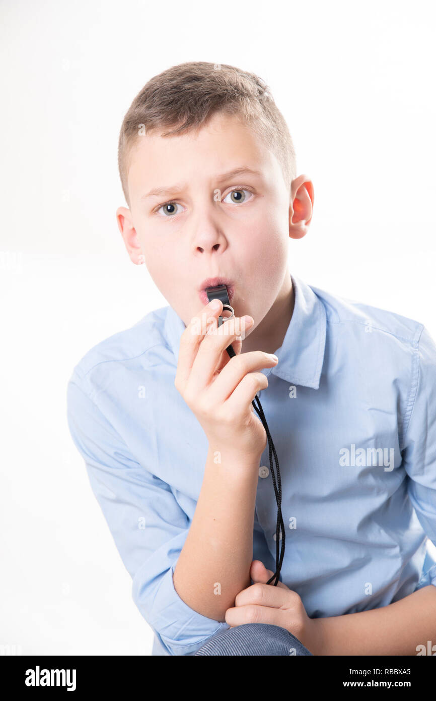 Boy with whistle on white background Stock Photo - Alamy