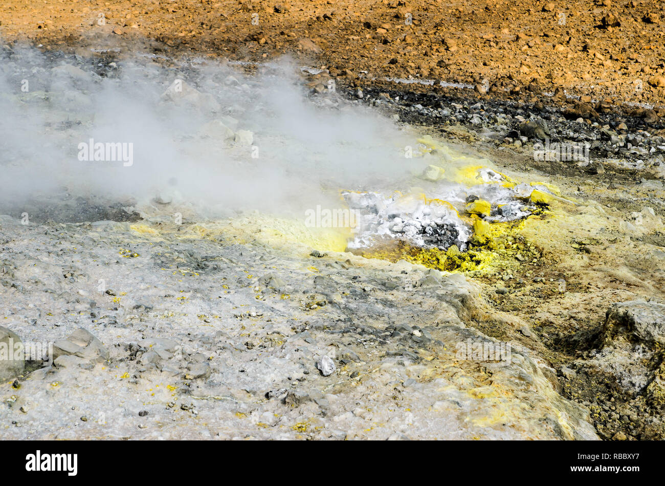 Yellow Sulphur crystals on surface rocks of a volcano crater on the ...