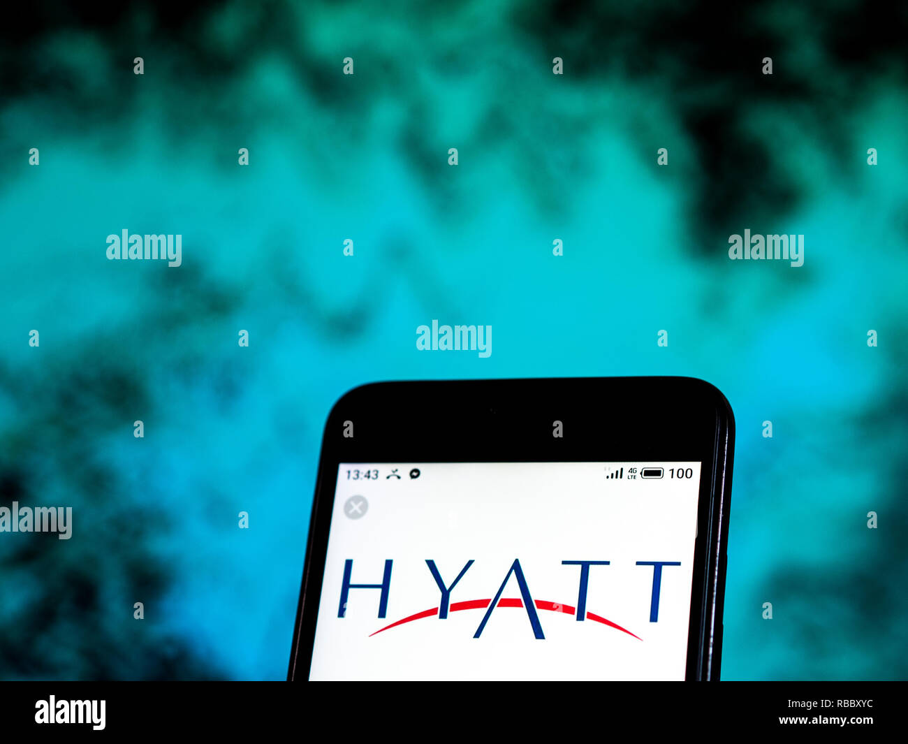 Hyatt Hotels Corporation logo seen displayed on smart phone Stock Photo ...